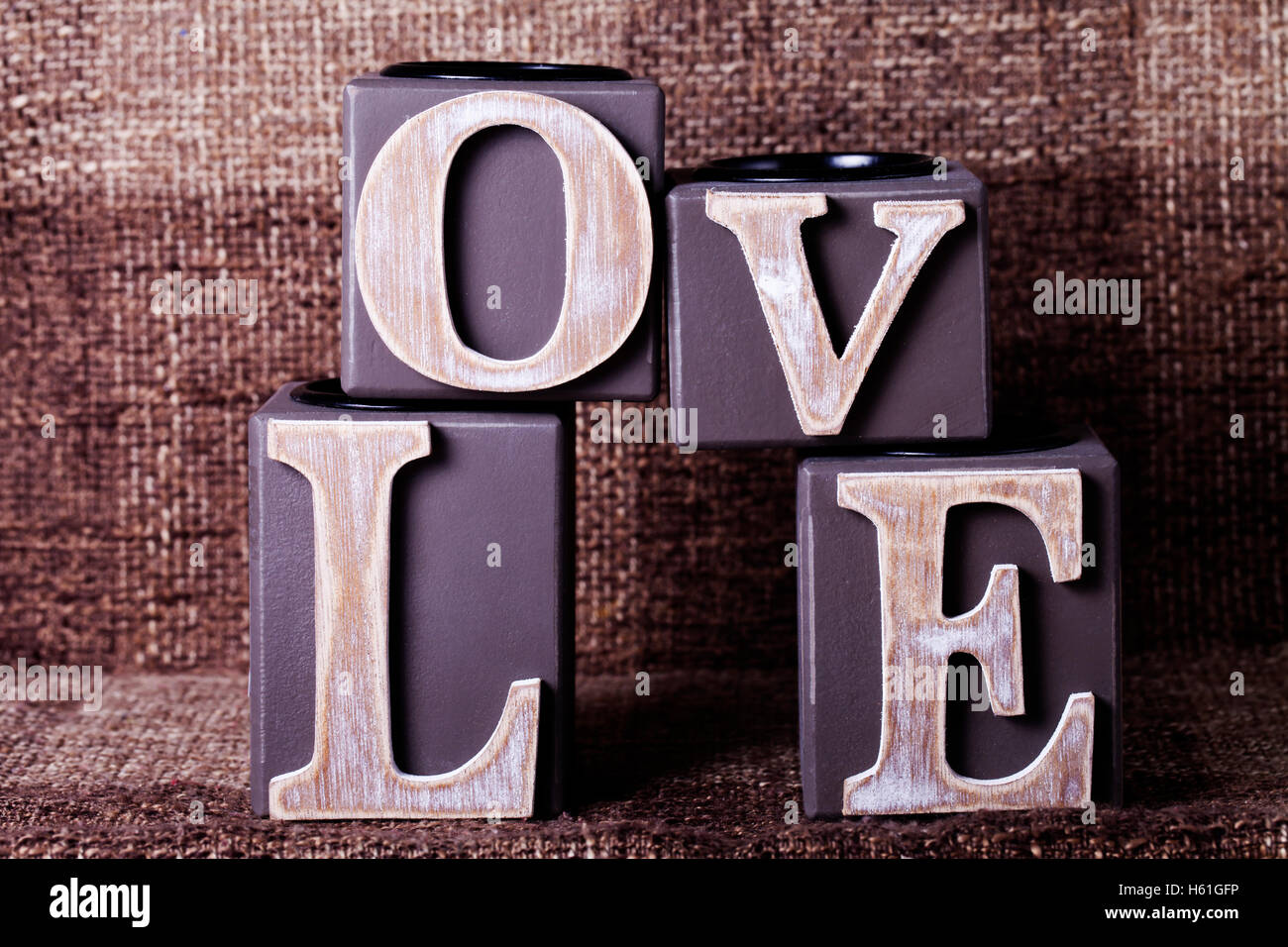 a word love from cubes on a brown background Stock Photo - Alamy