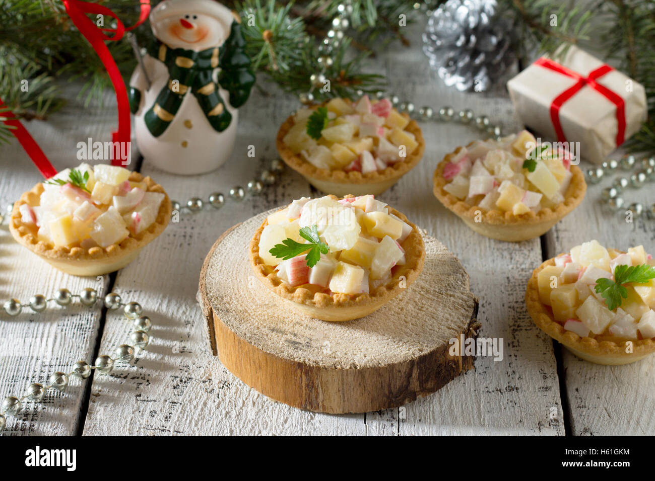 Holiday hors d'oeuvre: tartlets with crab sticks, cheese and pineapple ...