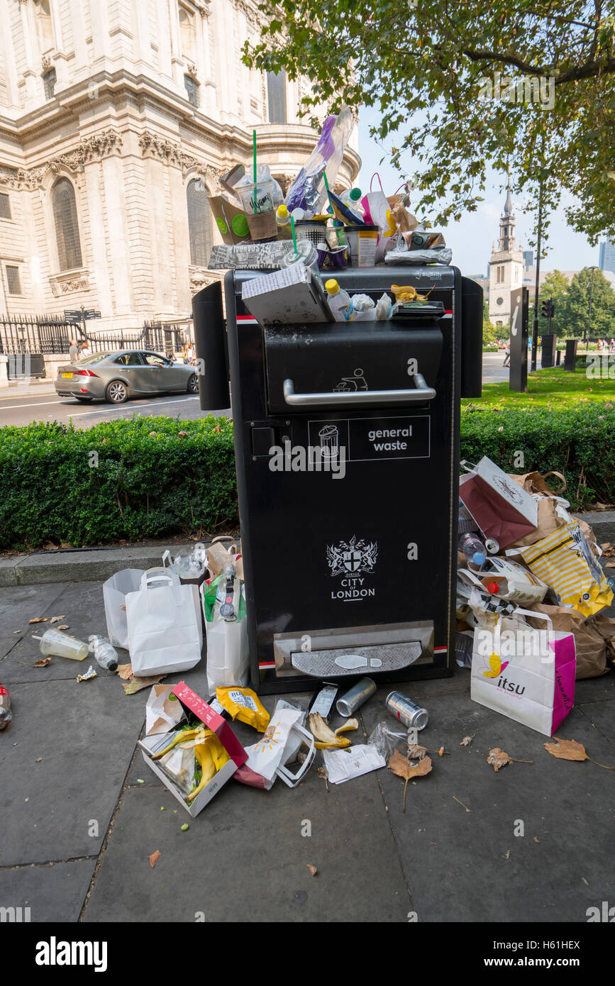 Overloaded rubbish bin in the City of London Stock Photo - Alamy