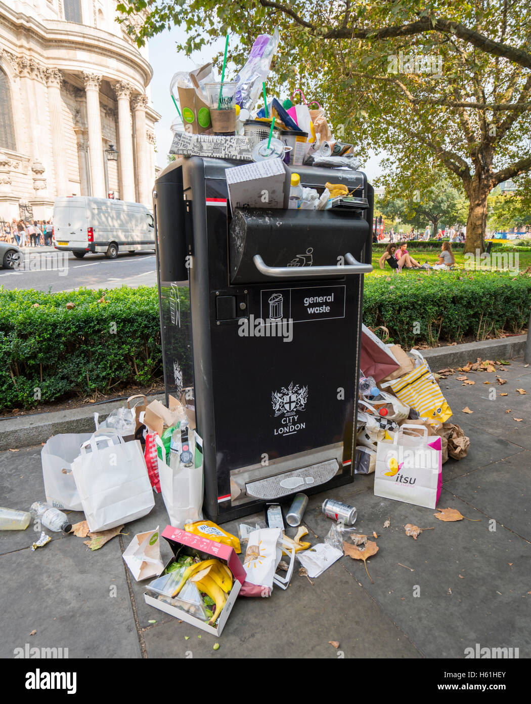 Overloaded rubbish bin in the City of London Stock Photo - Alamy