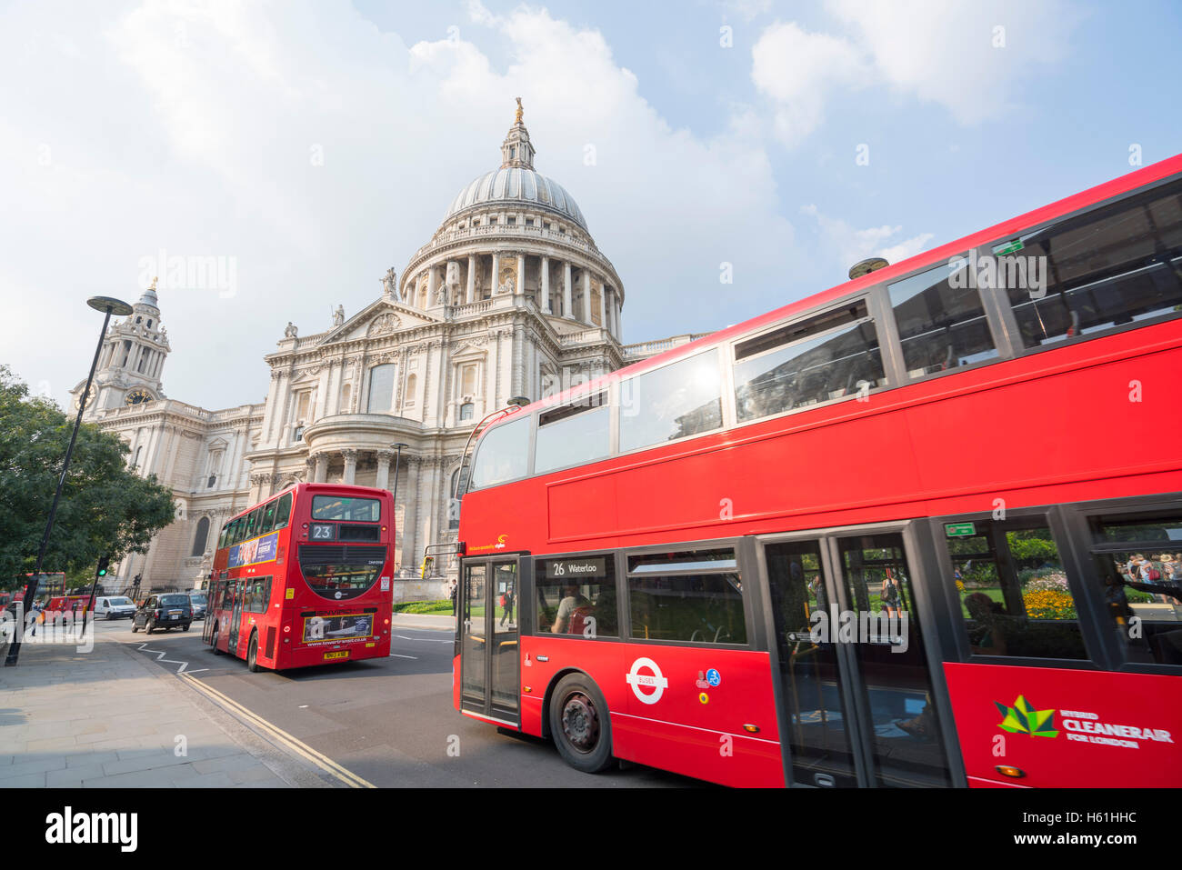 Red Buses in the streets London - typical street view Stock Photo - Alamy