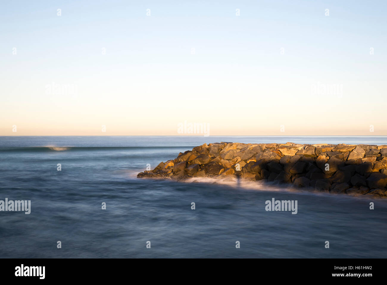 rock jetty, ocean view Stock Photo - Alamy