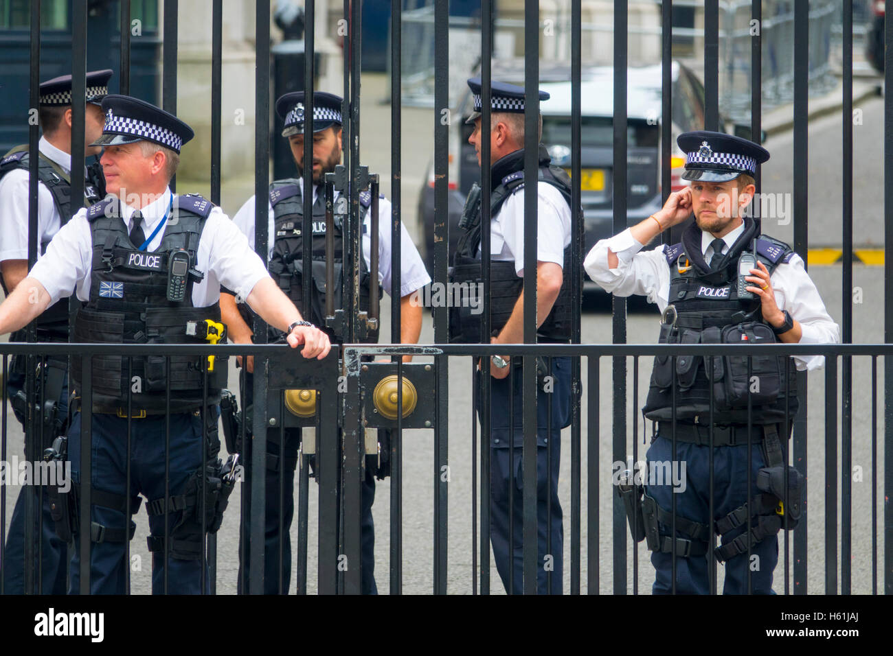 London Police officers guarding Downing Street Stock Photo - Alamy
