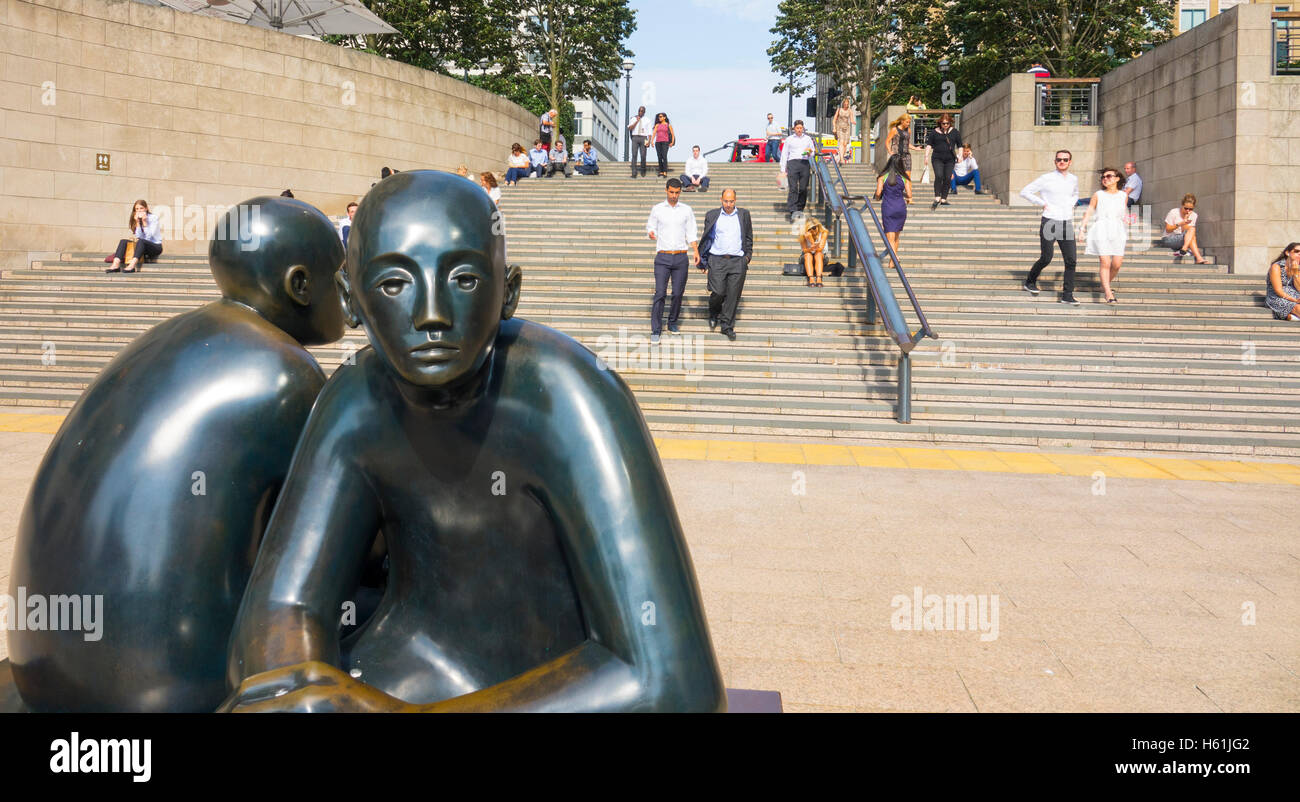 Bronze Statue of two sitting men at Cubitt Steps in Canary Wharf Stock ...