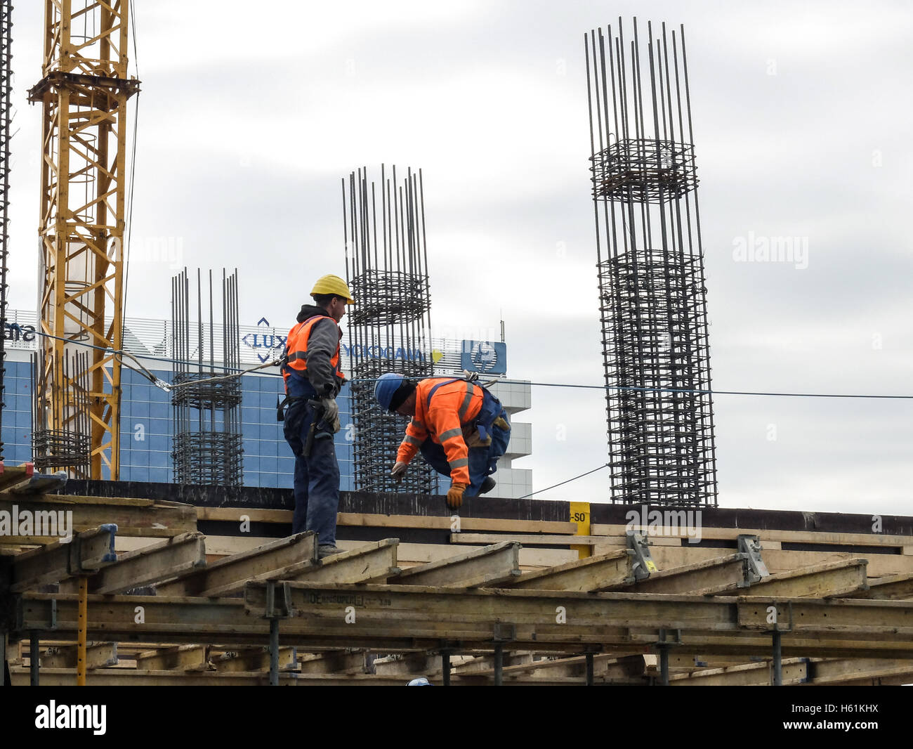 Bucharest, Romania, 25 February 2016: Laborers work at the construction ...