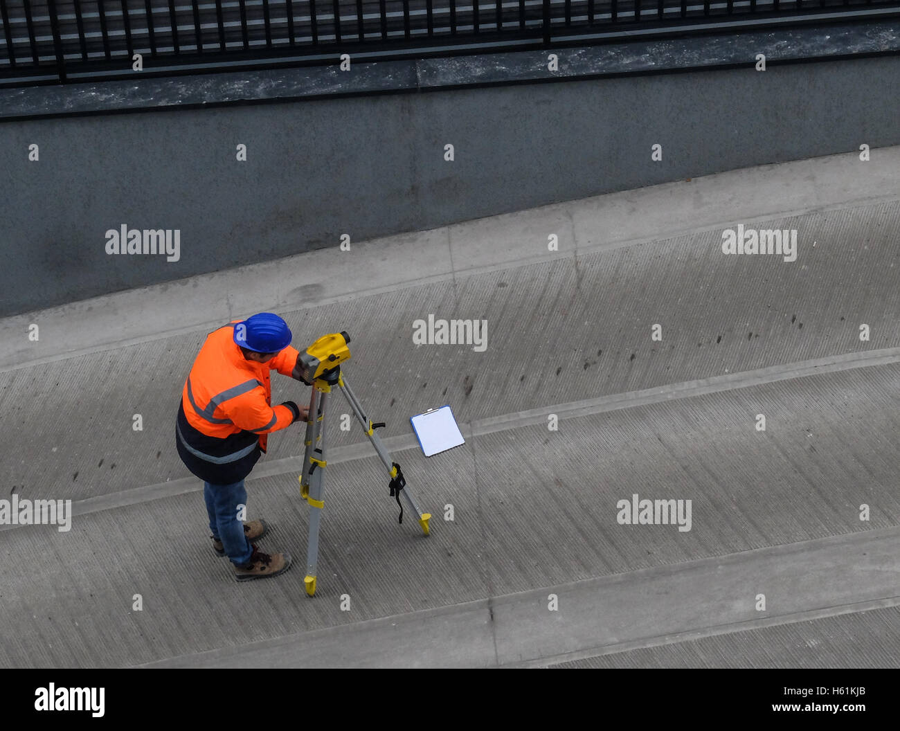Bucharest, Romania, 19 February 2016: A topographer makes measurements ...