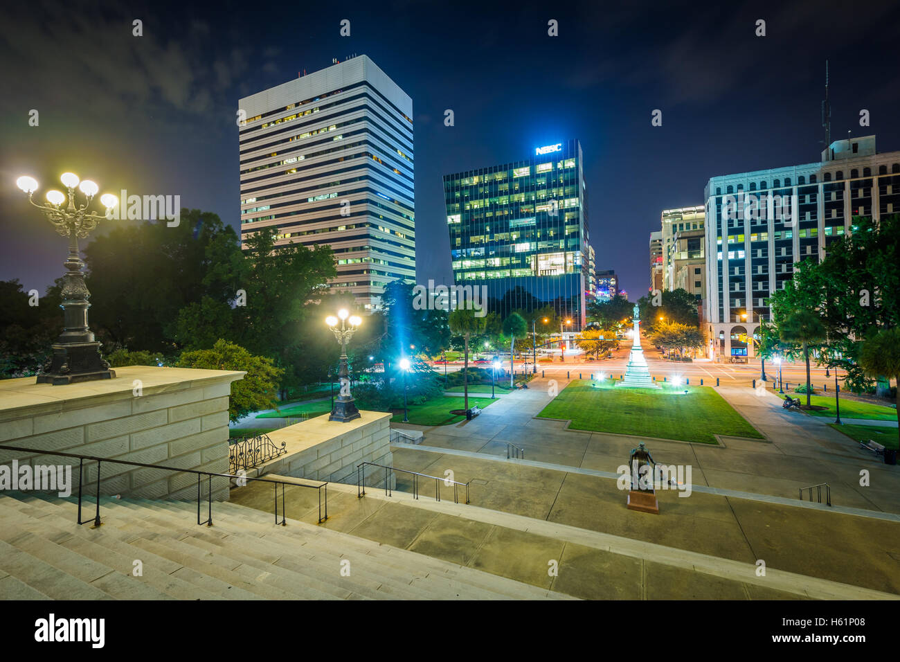 Steps to the South Carolina State House and modern buildings at night ...