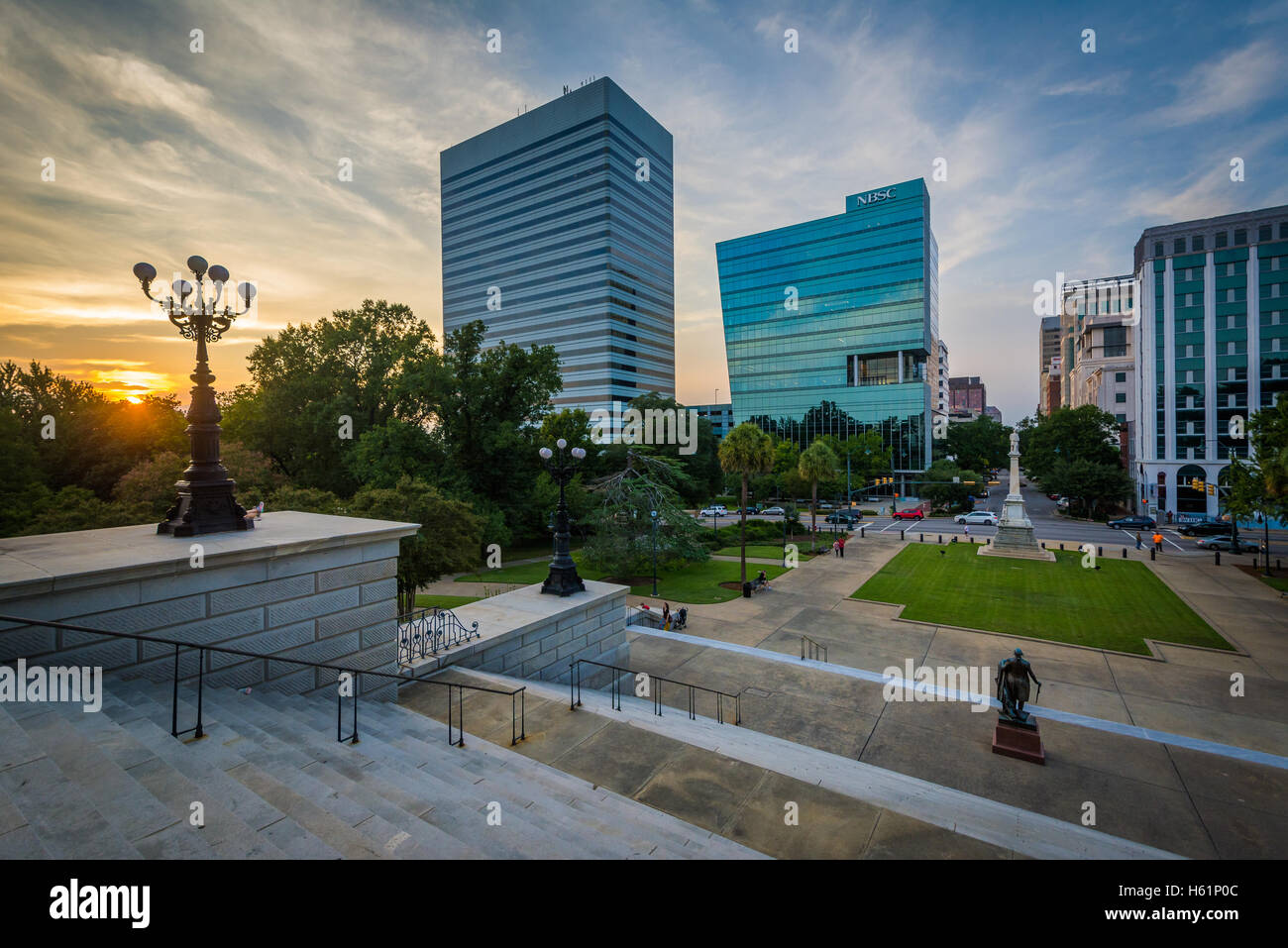 Steps to the South Carolina State House and modern buildings at sunset ...