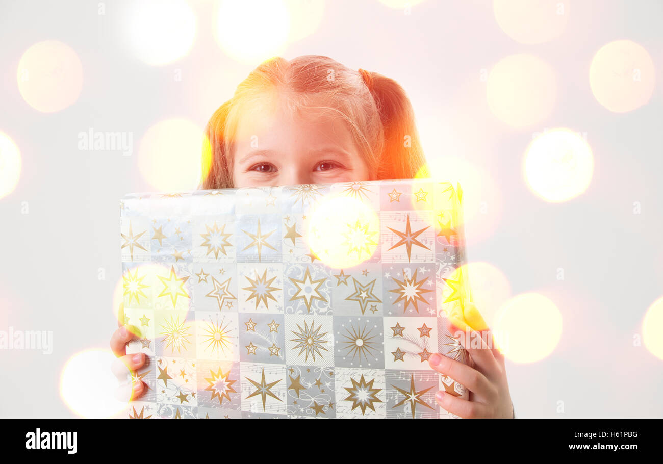 Child giving present hi-res stock photography and images - Alamy