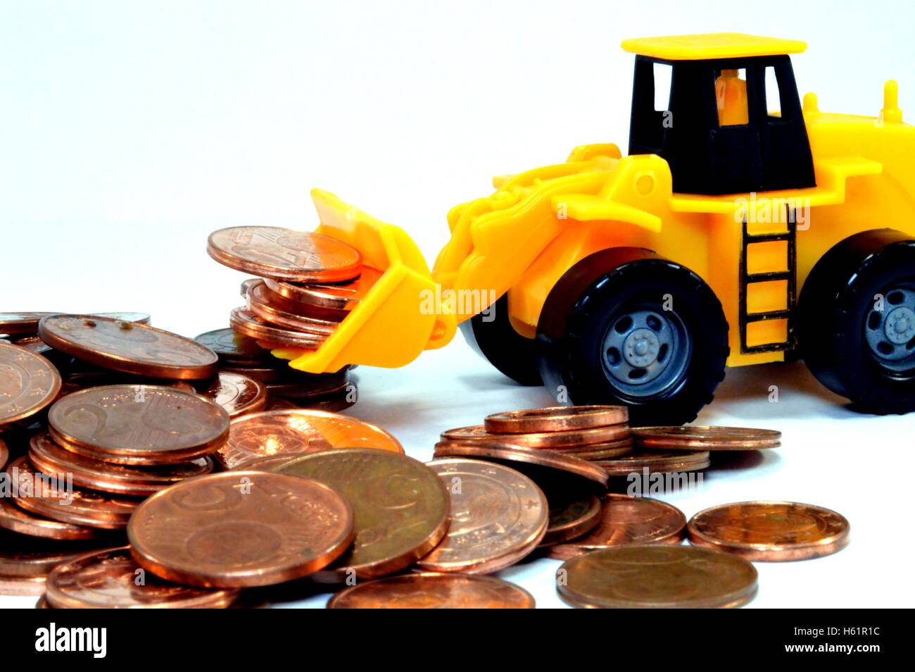 Yellow bulldozer load rooms of several hundred euros Stock Photo - Alamy