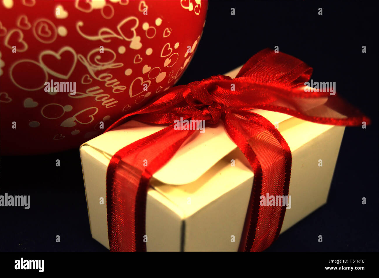 Ball of Valentine's Day of red color with a present Stock Photo - Alamy