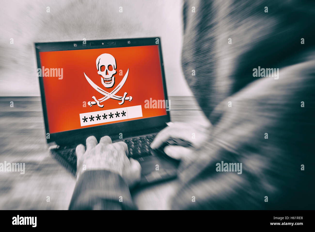 Back view of a hacker wearing a hoodie and stealing a password on a ...