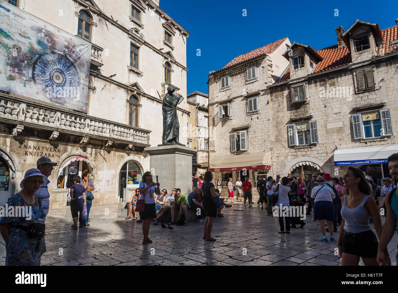Lots of tourists at Trg Brace Radic and Statue of Marko Marulić by Ivan ...
