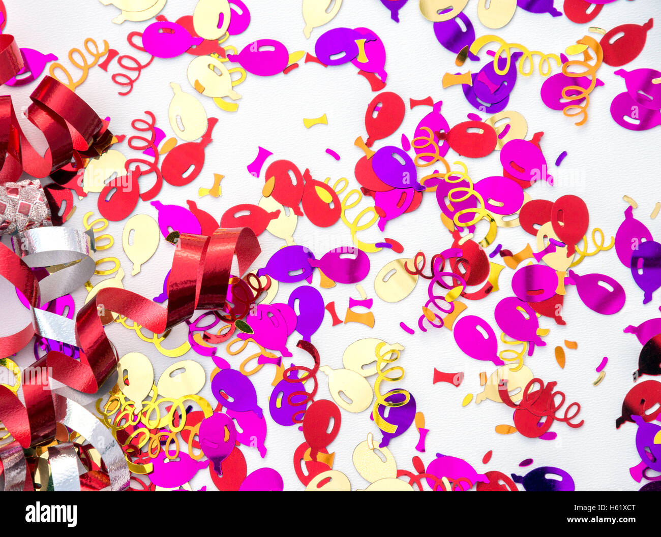 Celebration themed confetti and ribbons in balloon and streamer shapes ...