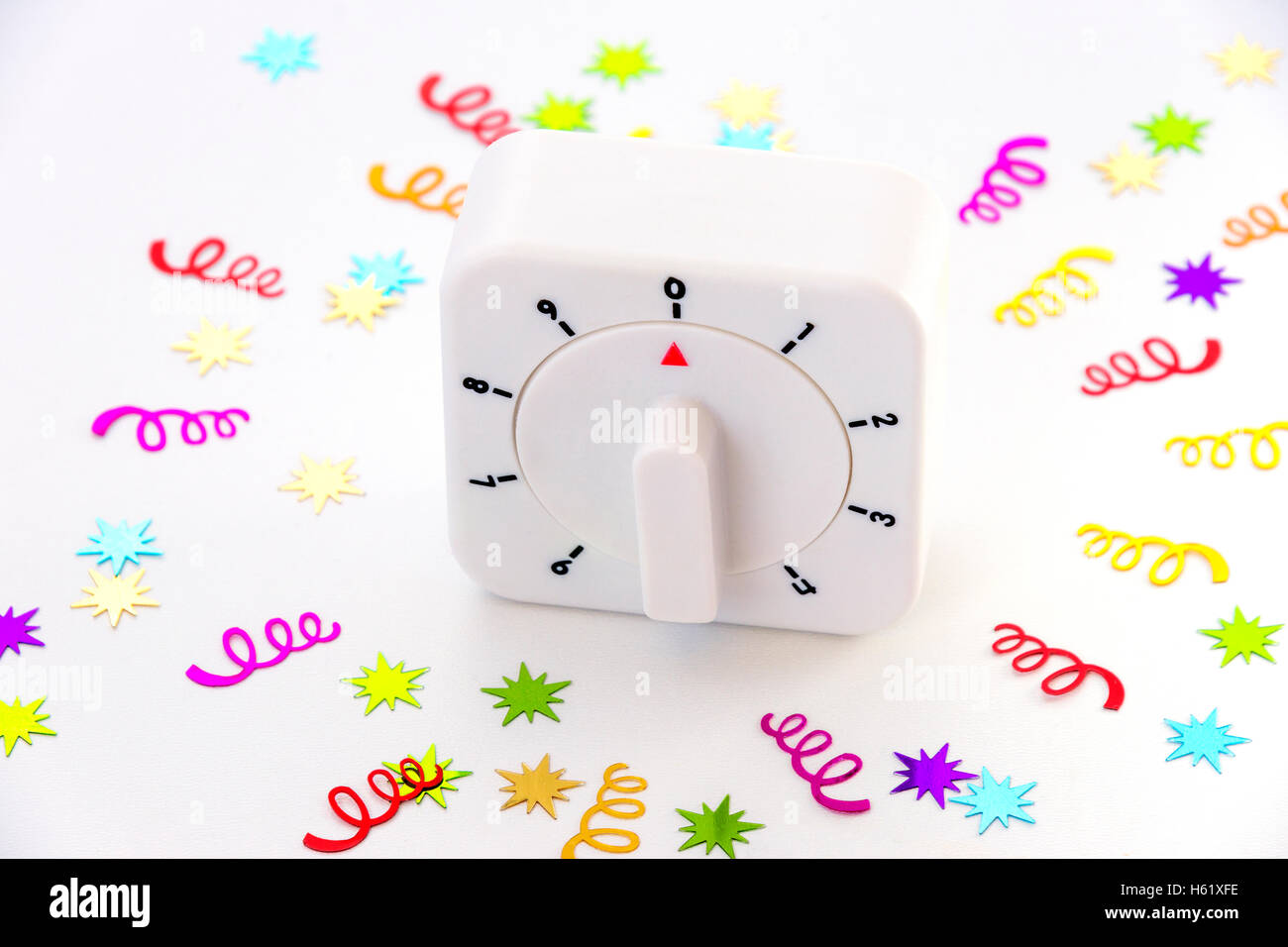 A countdown timer at zero with stars and spiral confetti bursting out ...