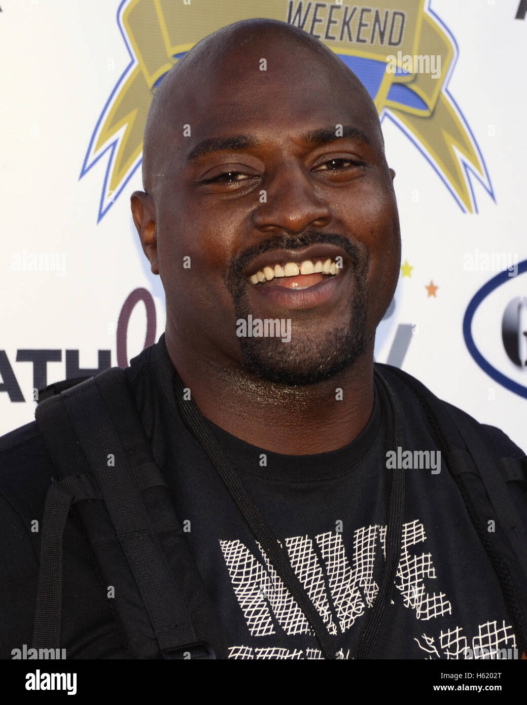 Marcellus Wiley arrived at the Athletes Vs. Cancer Celebrity Flag ...
