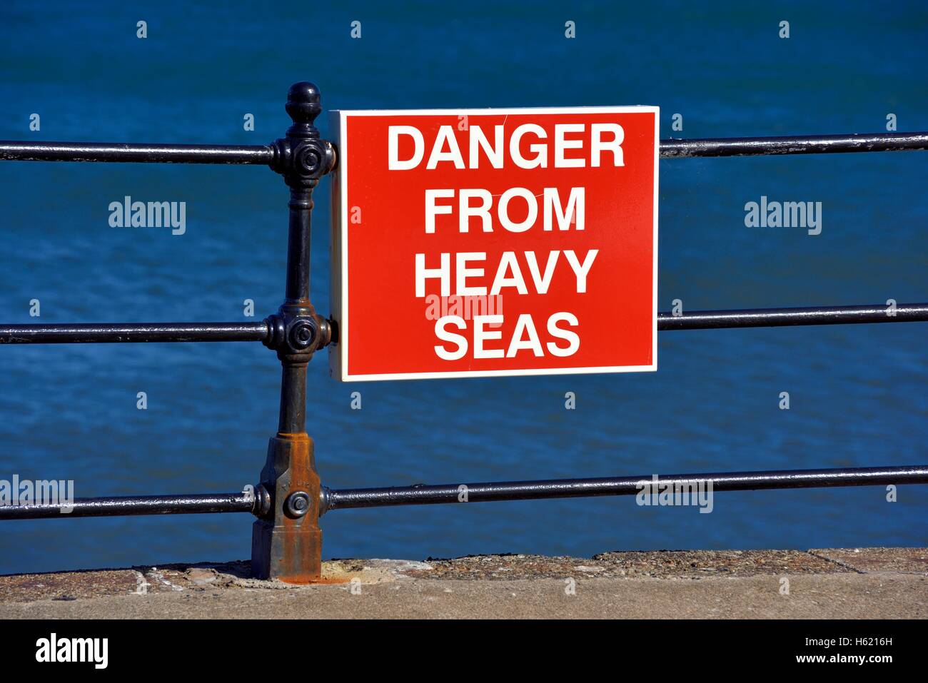 Danger from heavy seas sign on seafront railings in Scarborough North ...