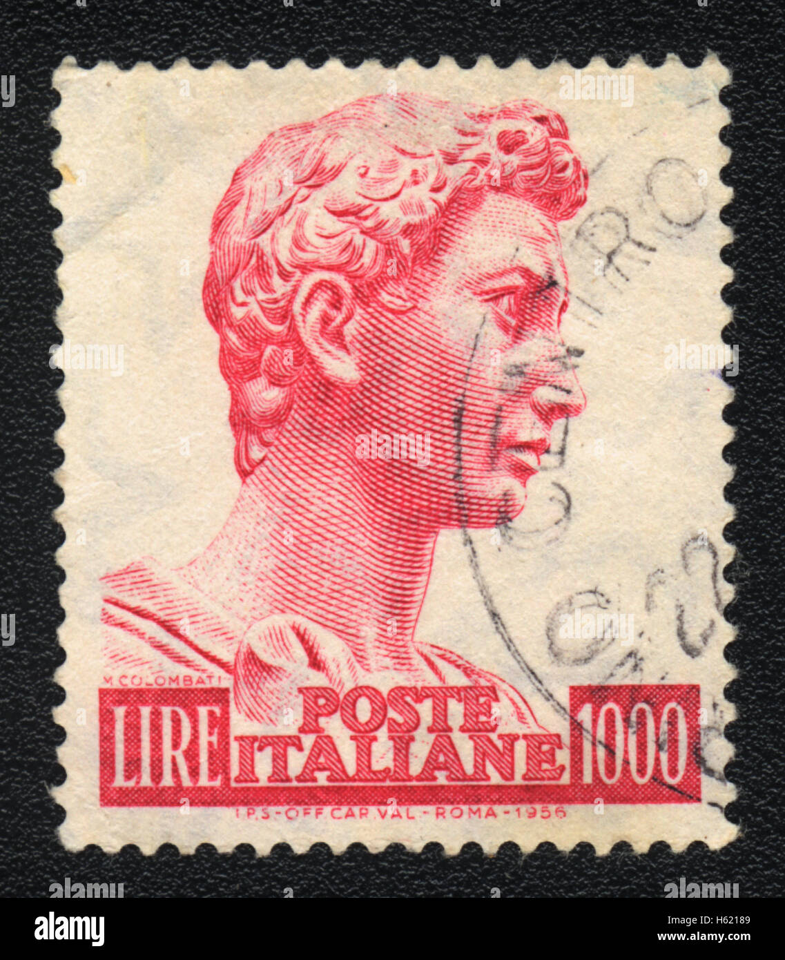 A postage stamp printed in Italy shows Head of the statue of St. George ...