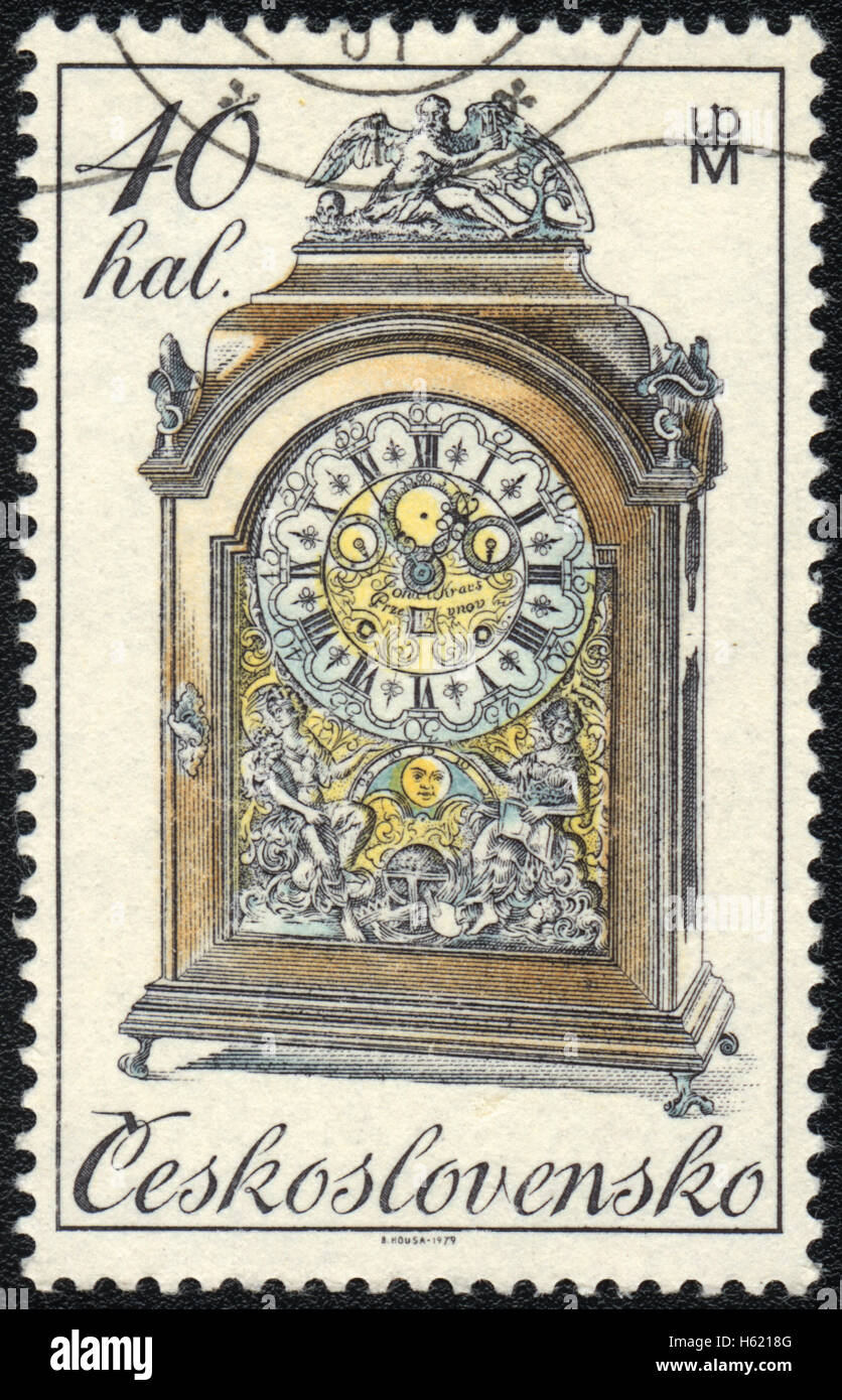 A postage stamp printed in Czechoslovakia, shows an antique mantel ...
