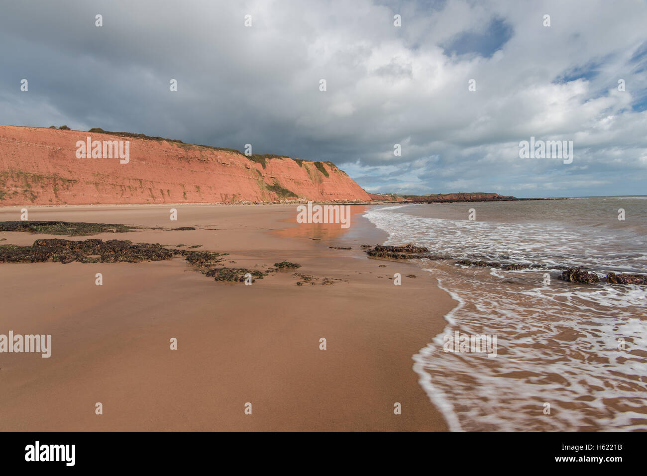 sandy beach with red sand in Exmouth ,Devon, UK. Jurassic coast ...