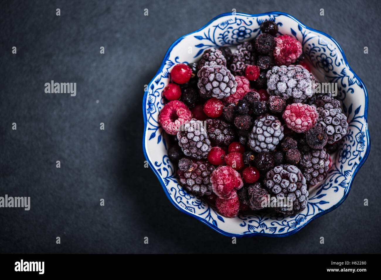 Bowl with frozen black forest fruits mixed Stock Photo - Alamy