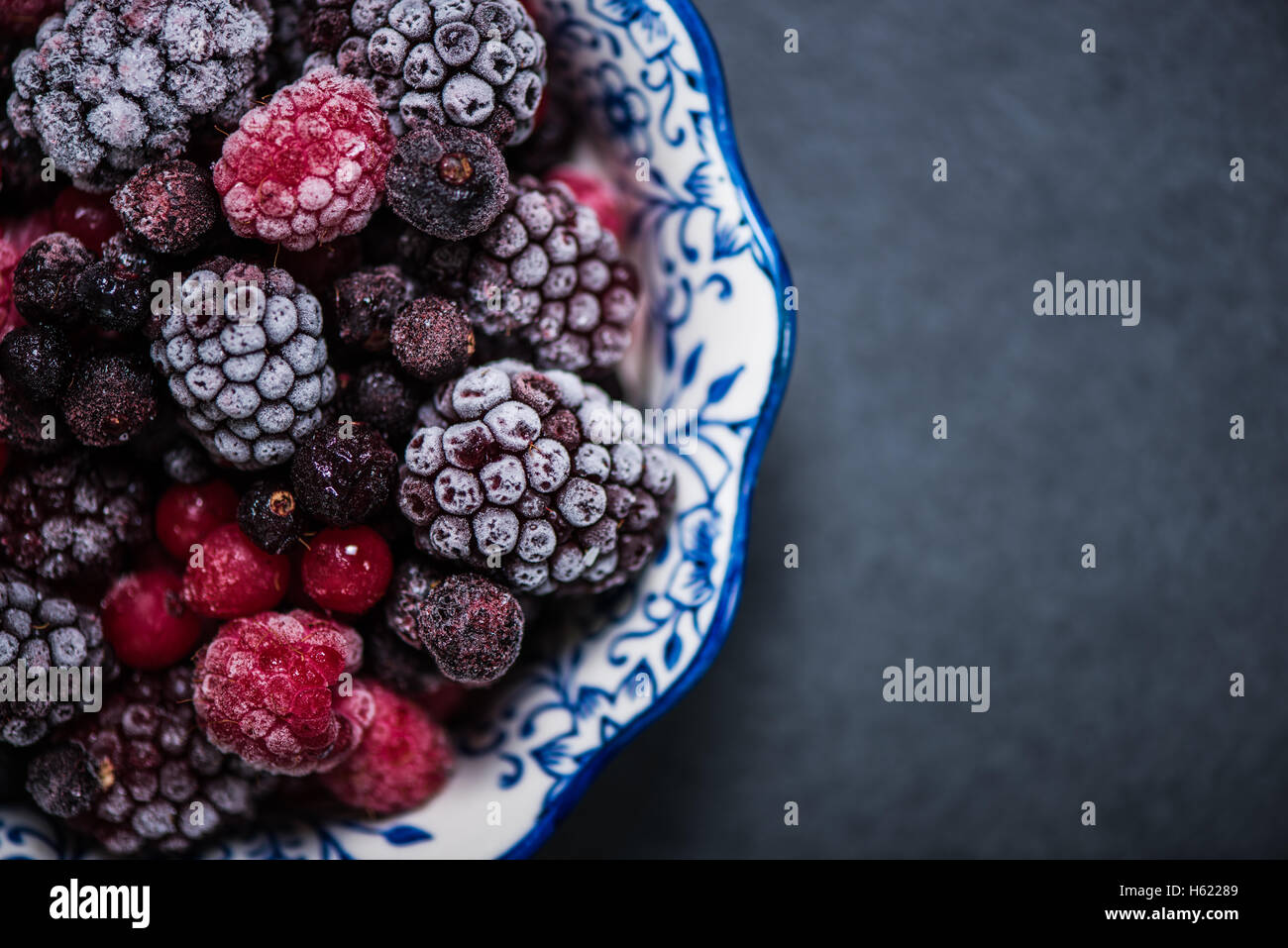 Bowl with frozen black forest fruits mixed Stock Photo - Alamy