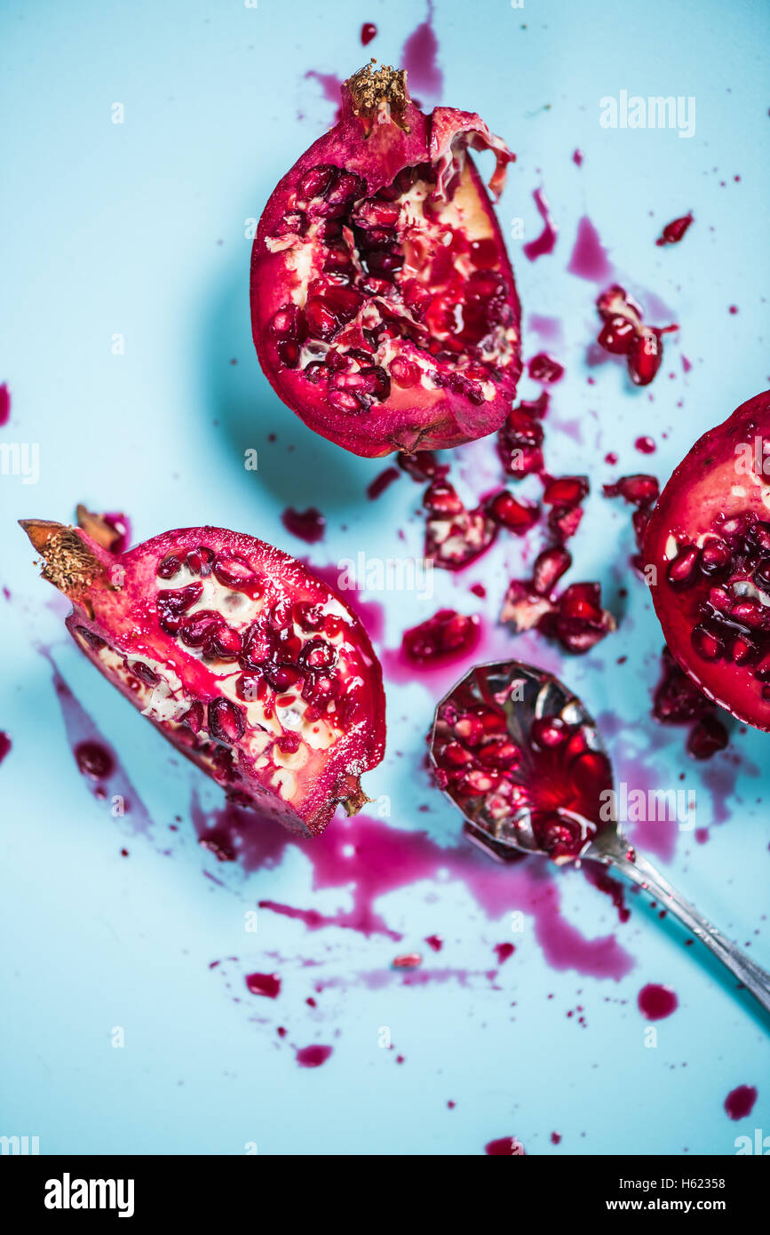 Pomegranate mess with seeds and juice on vibrant pastel board Stock ...
