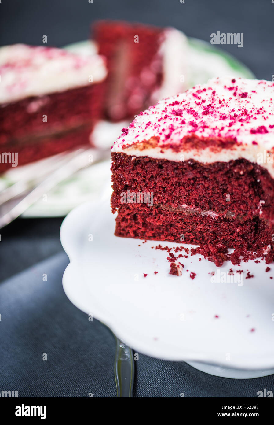 Red velvet sponge cake cut, with icing sugar top Stock Photo - Alamy
