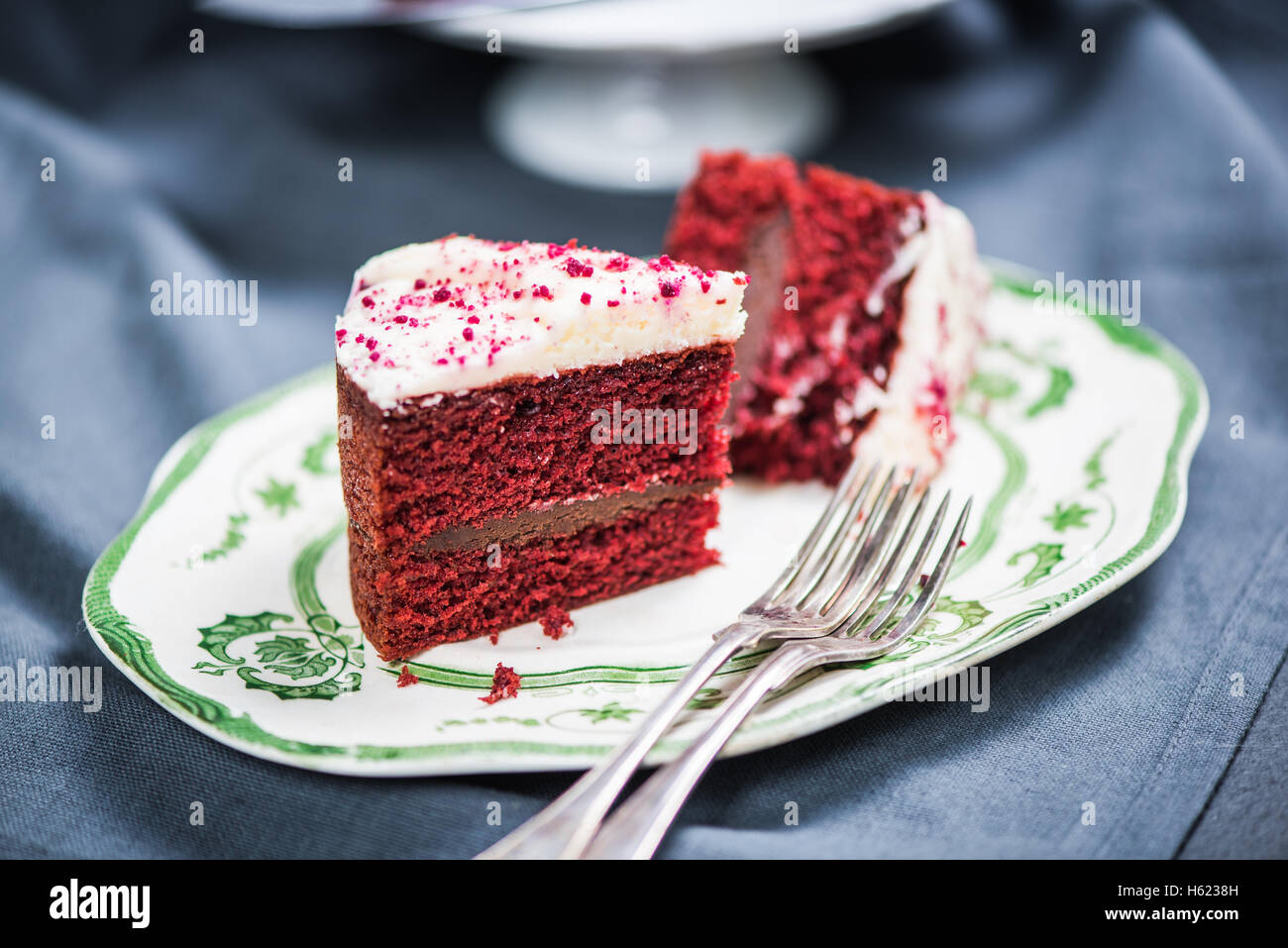 Slice of red velvet sponge cake on serving plate Stock Photo - Alamy