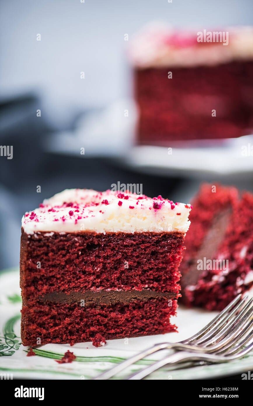 Slice of red velvet sponge cake on serving plate Stock Photo - Alamy