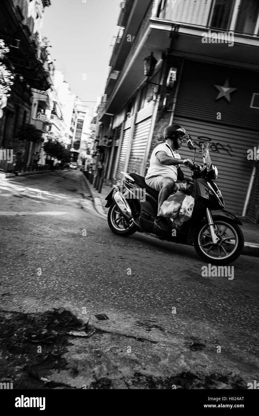 Man riding scooter Stock Photo - Alamy
