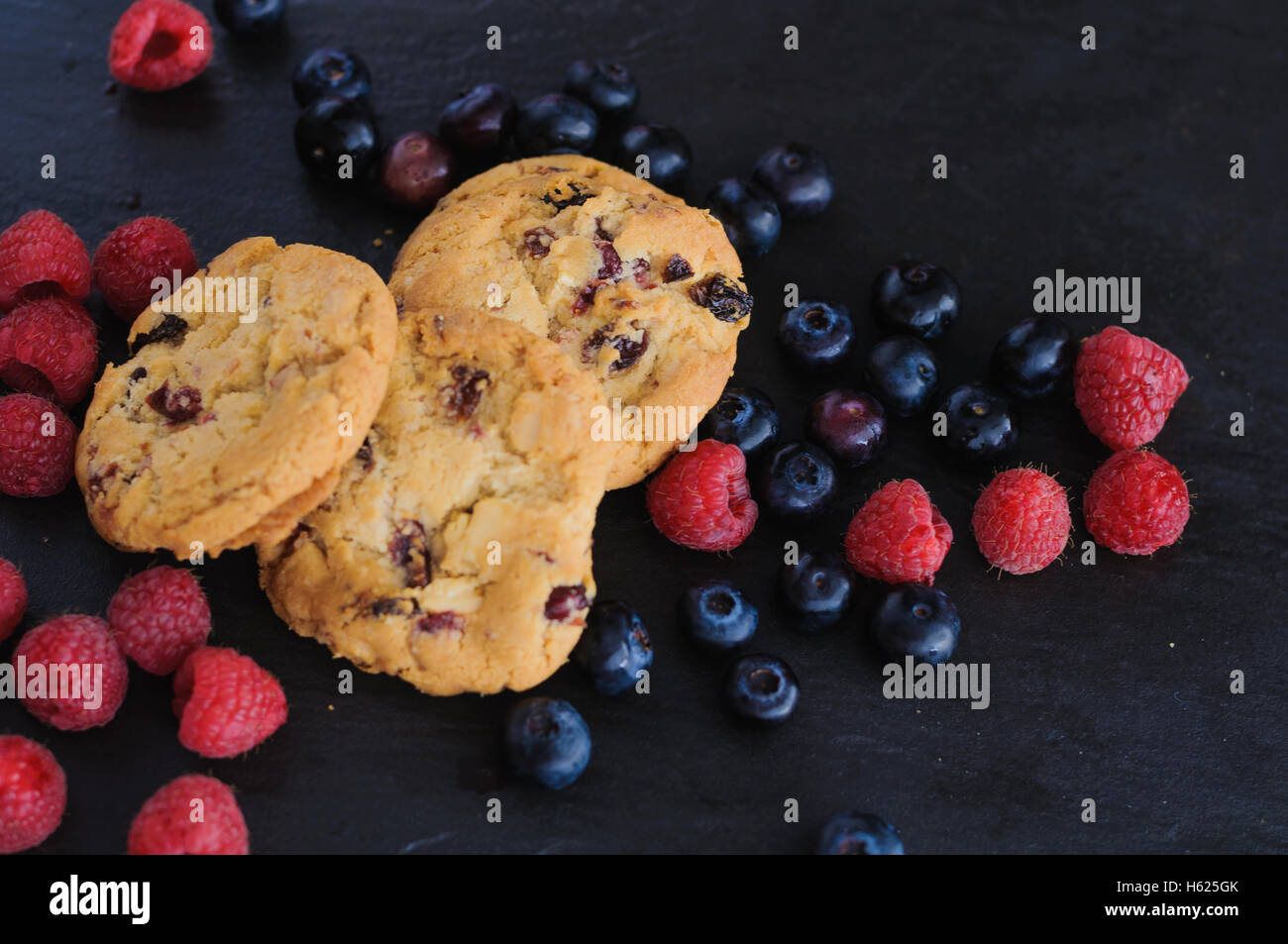 cookies raspberries blueberries Stock Photo - Alamy
