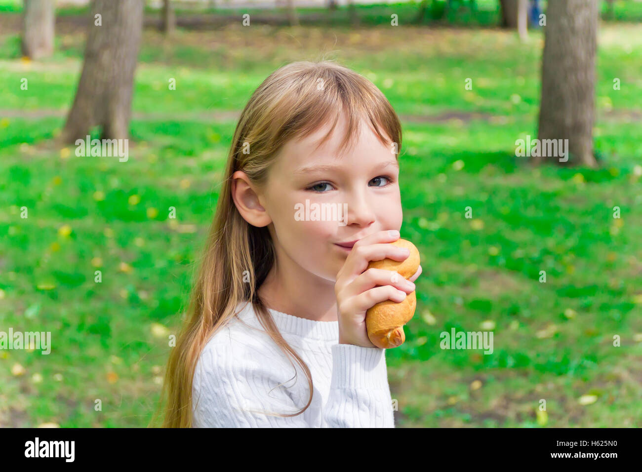 Eating cute girl Stock Photo - Alamy