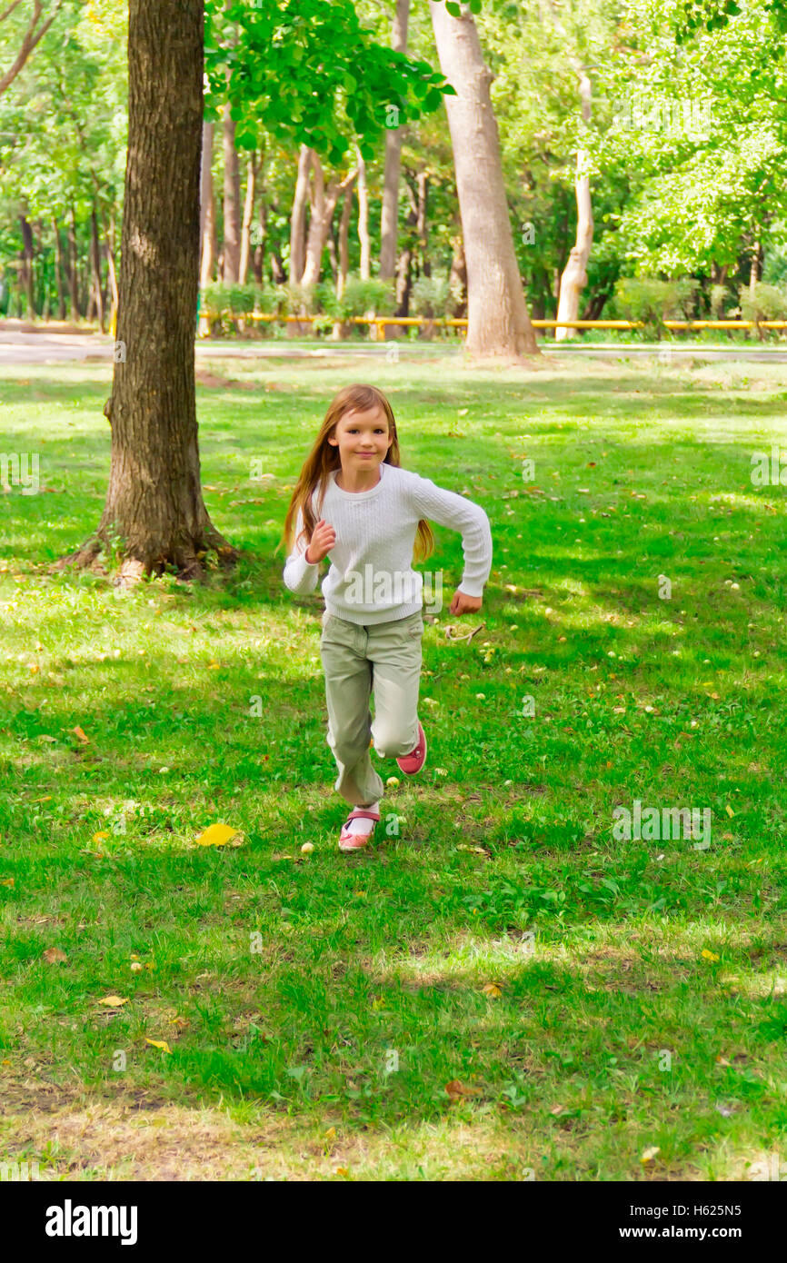 Photo of cute running girl in summer Stock Photo - Alamy