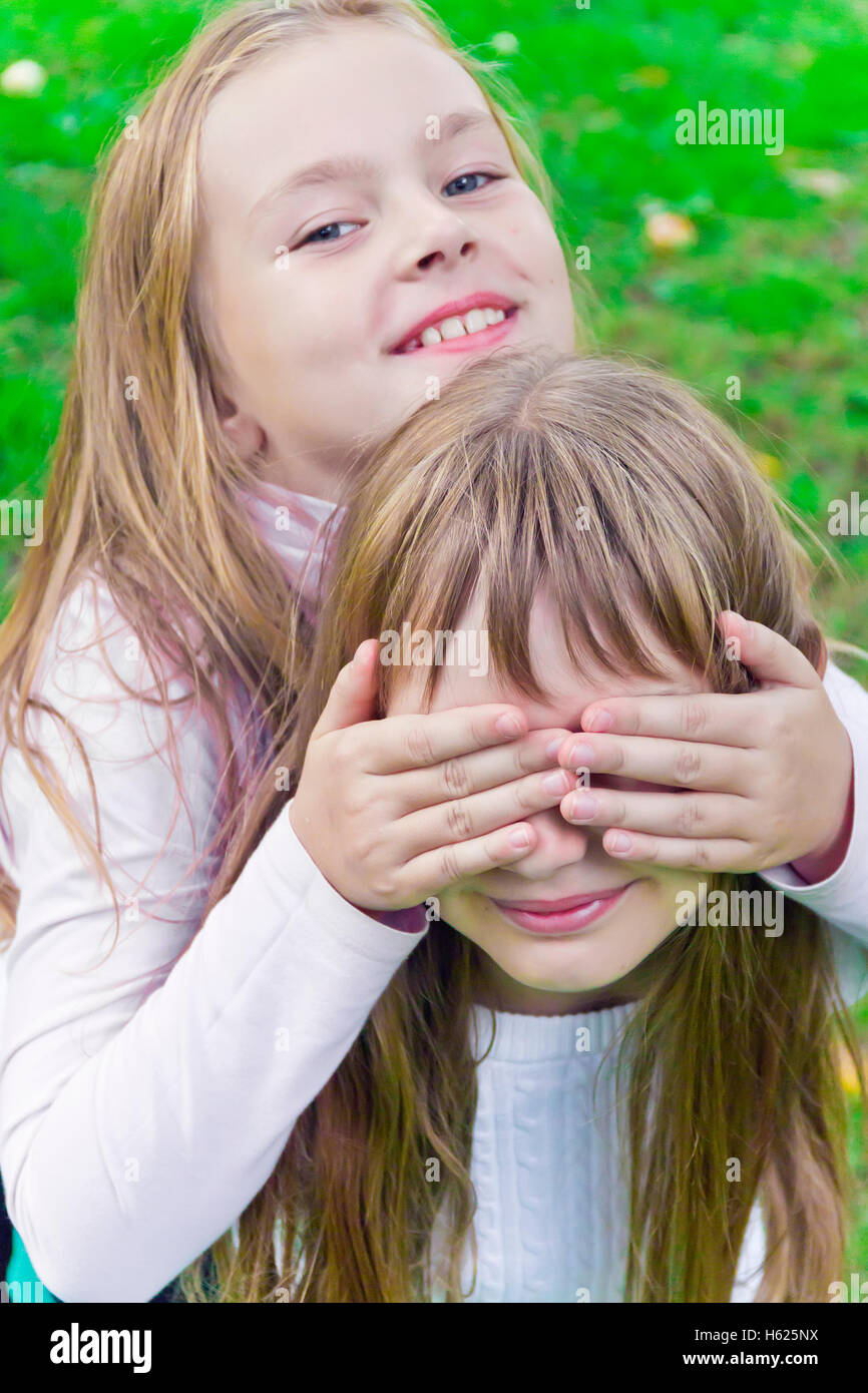 Cute two playing girls Stock Photo - Alamy