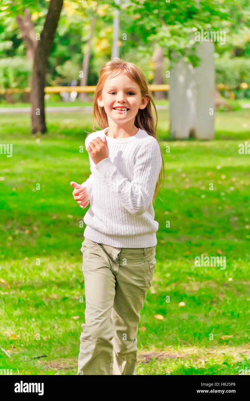 Cute running girl Stock Photo - Alamy