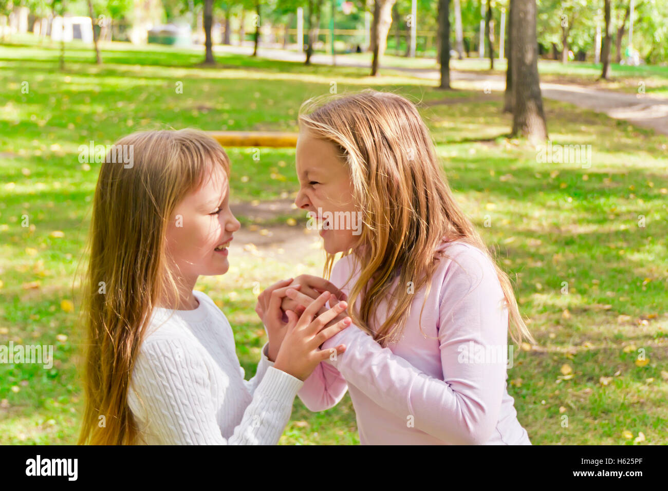 Cute two playing girls Stock Photo - Alamy