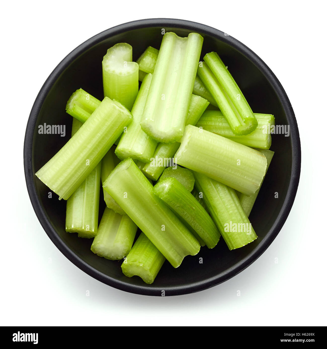 Bowl of celery sticks isolated on white background, top view Stock ...