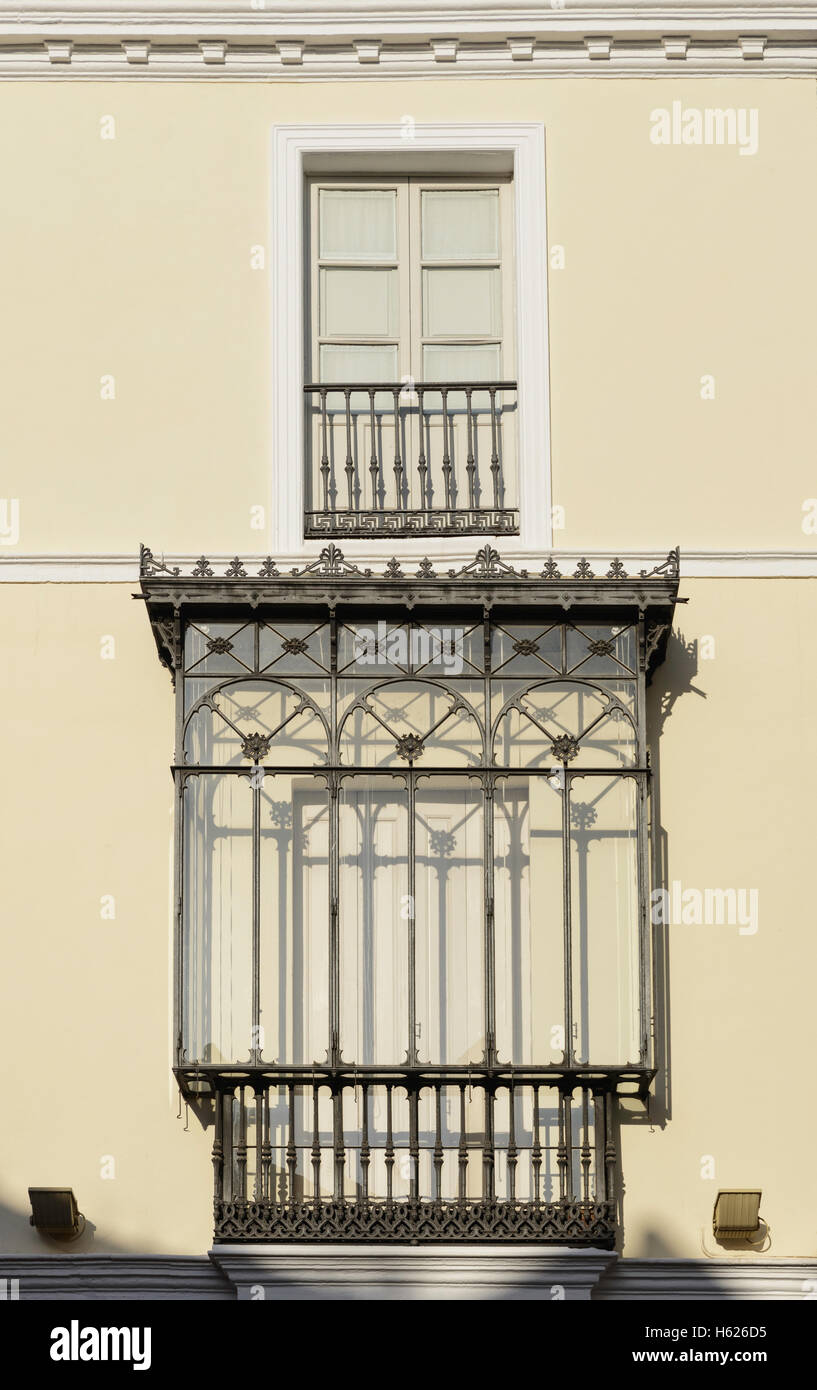 Traditional ornate ironwork and glass balcony window Santa Cruz Seville ...