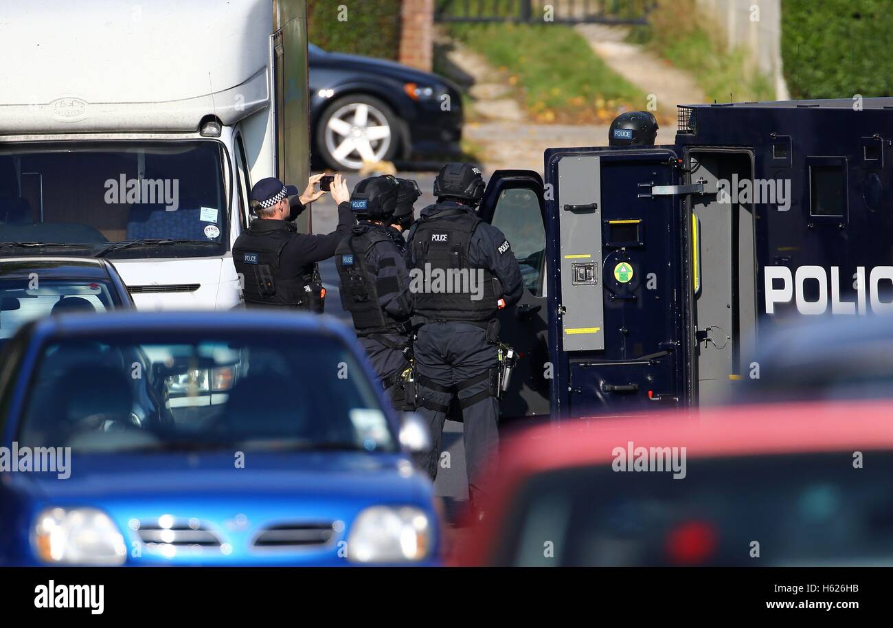 Armed police officers at the scene in Northolt, London, where they ...