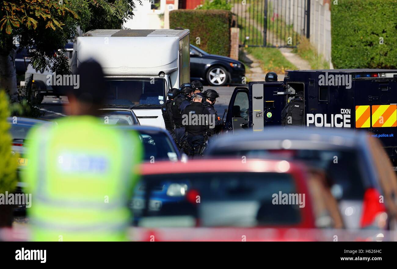 Armed police officers at the scene in Northolt, London, where they ...
