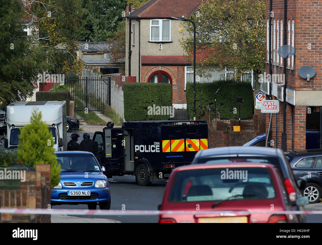 Armed police officers at the scene in Northolt, London, where they ...