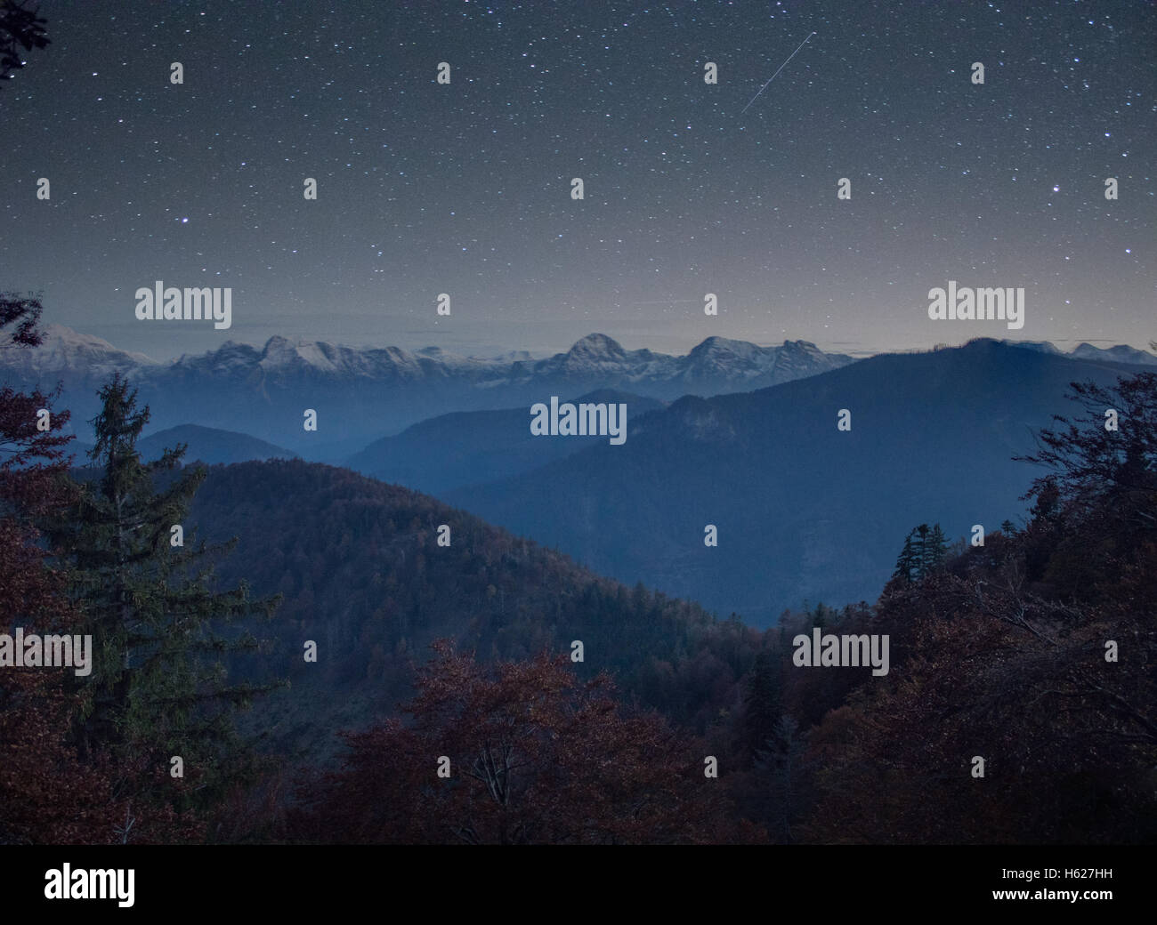 Night photograph of a meteor falling over an alpine landscape in Upper ...
