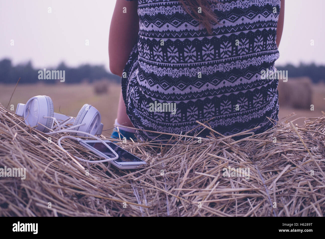 The back girl looks into the distance Stock Photo - Alamy