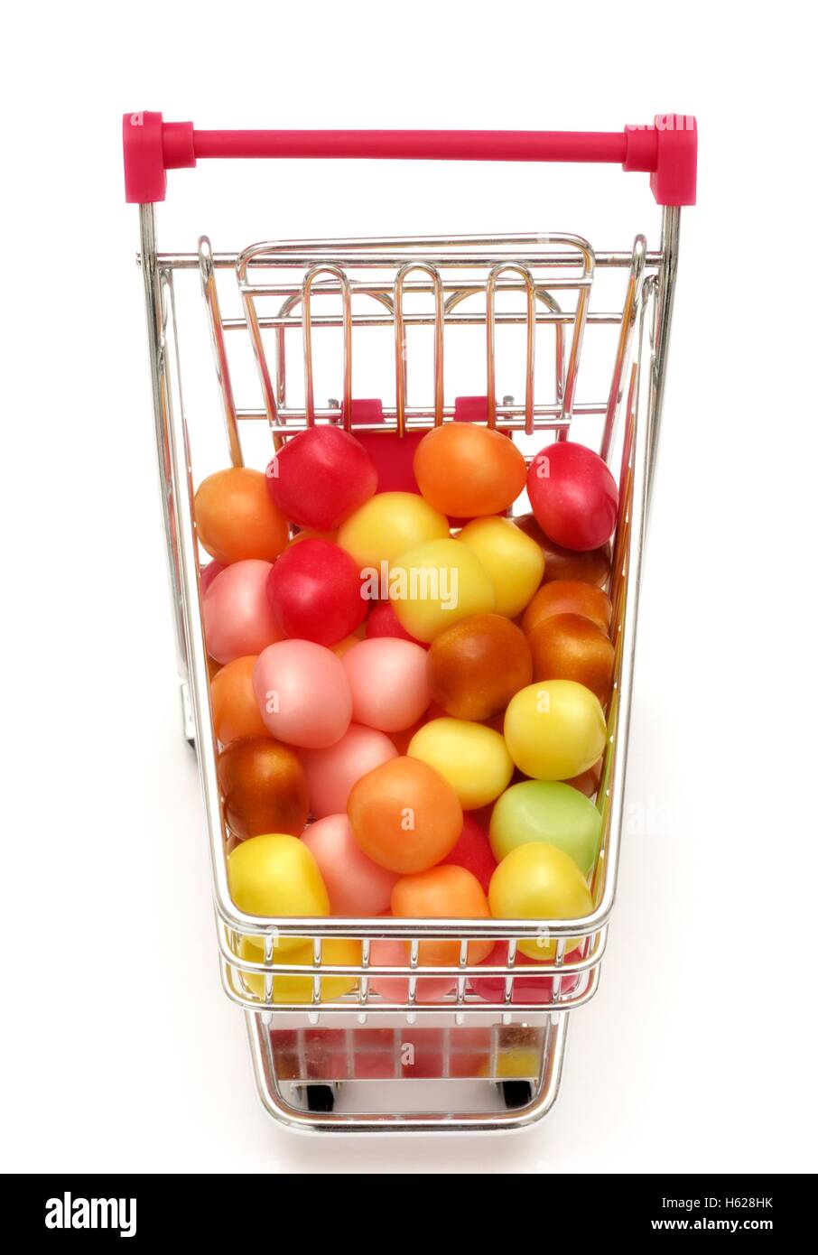 A miniature shopping trolley with candy coloured sweets Stock Photo - Alamy