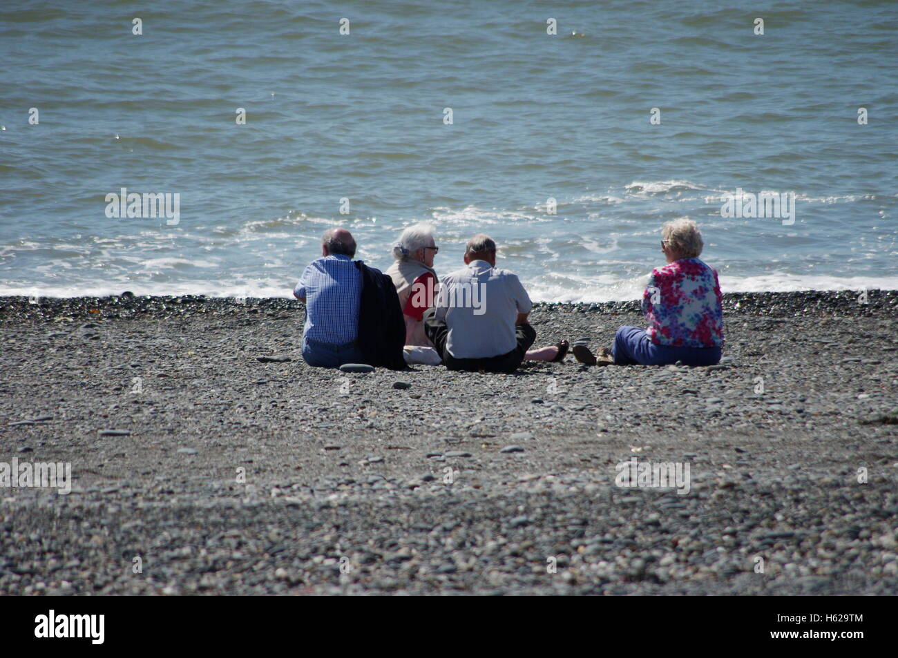 Old people on the beach , summer day by the sea Stock Photo - Alamy