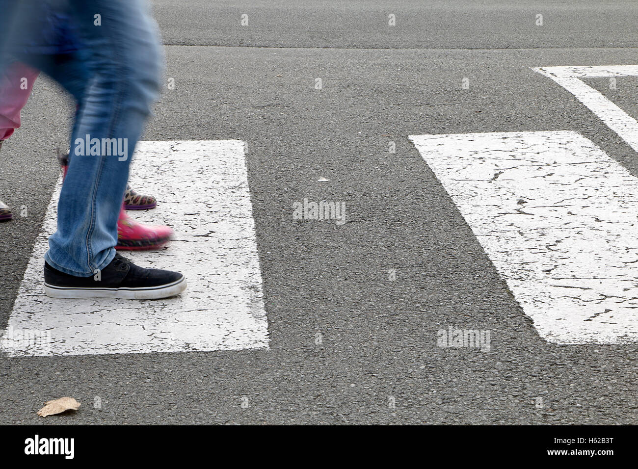 In the street, children crossing a crosswalk Stock Photo - Alamy
