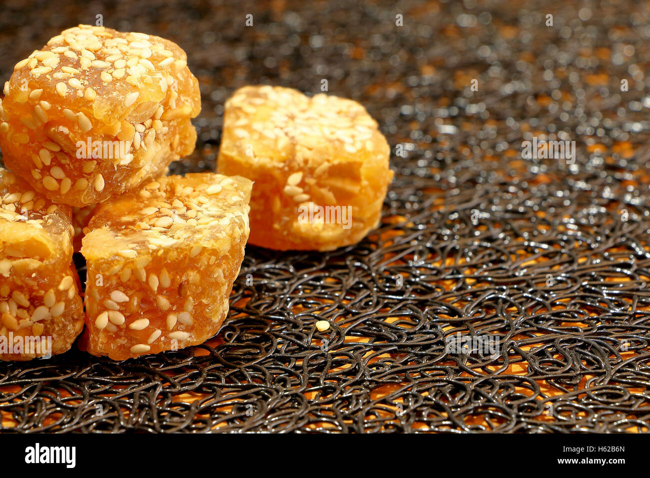 Chinese sesame candy on black background Stock Photo - Alamy
