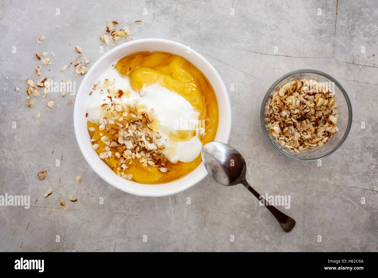 Mango creme with yogurt and nuts Stock Photo - Alamy
