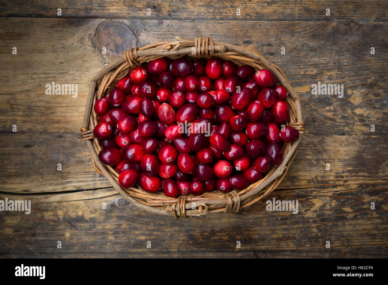 Cranberries in basket Stock Photo - Alamy
